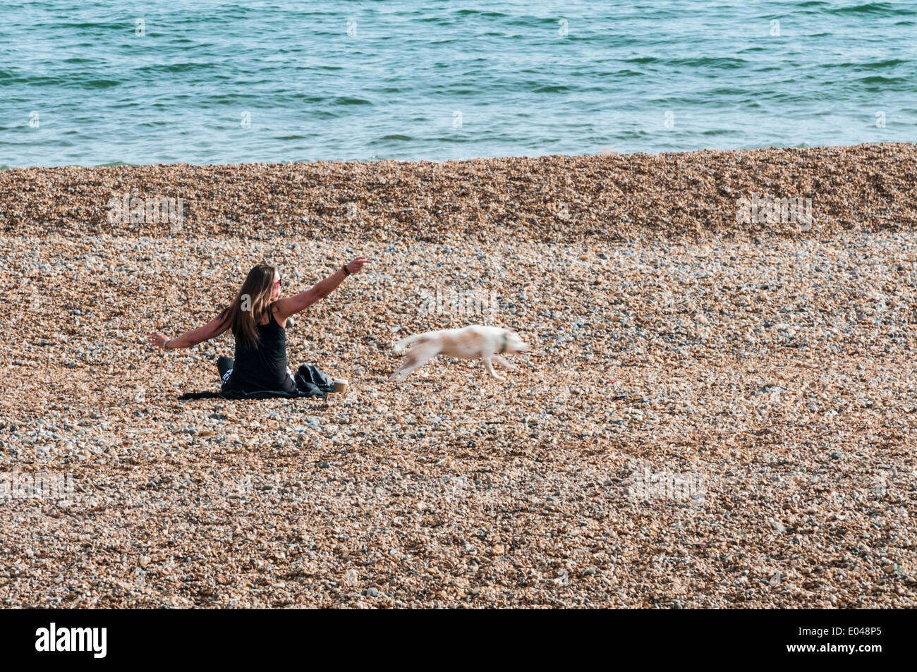 Woman throwing stone sea hi-res stock photography and images - Alamy