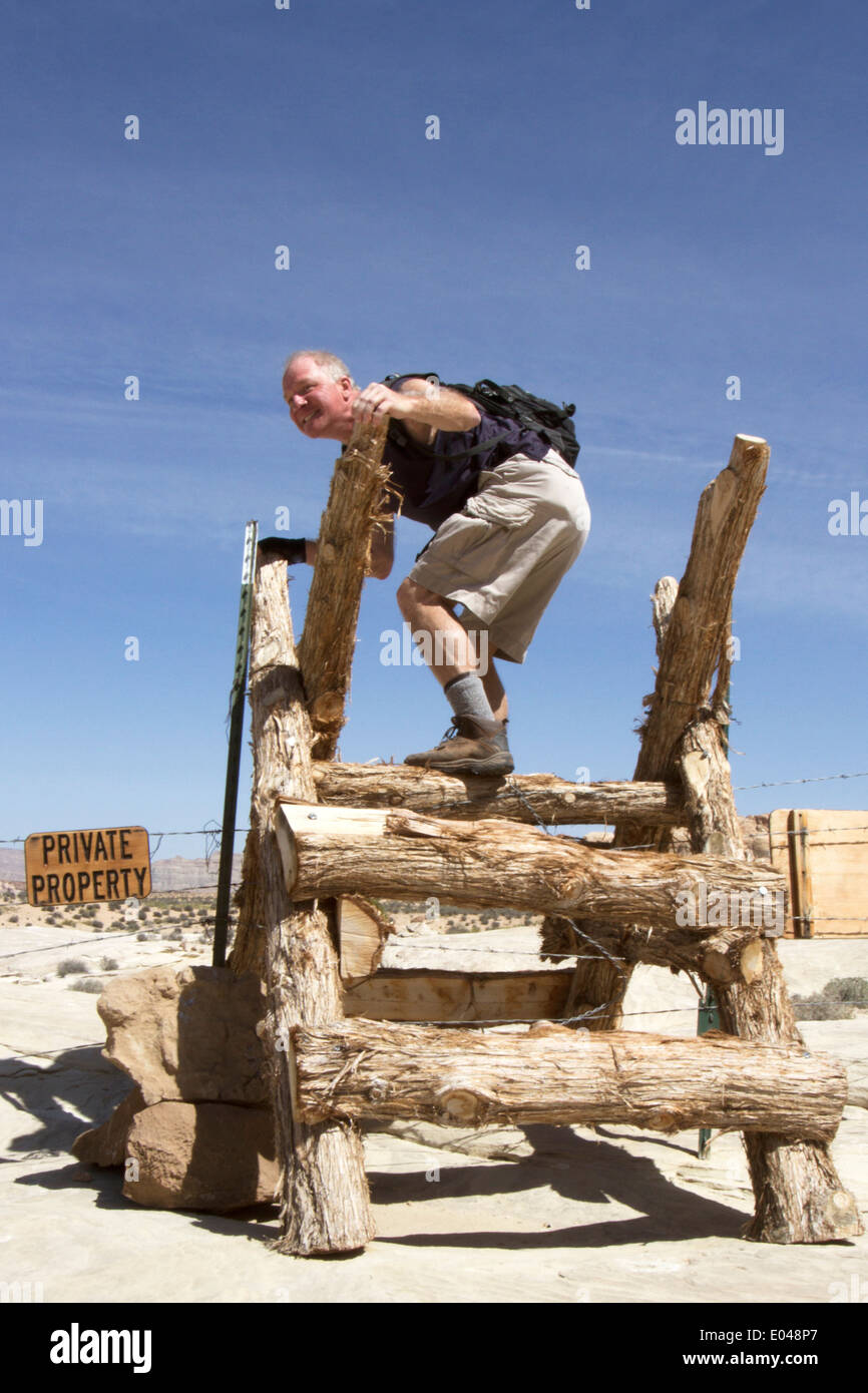 Climbing over fence hi-res stock photography and images - Alamy