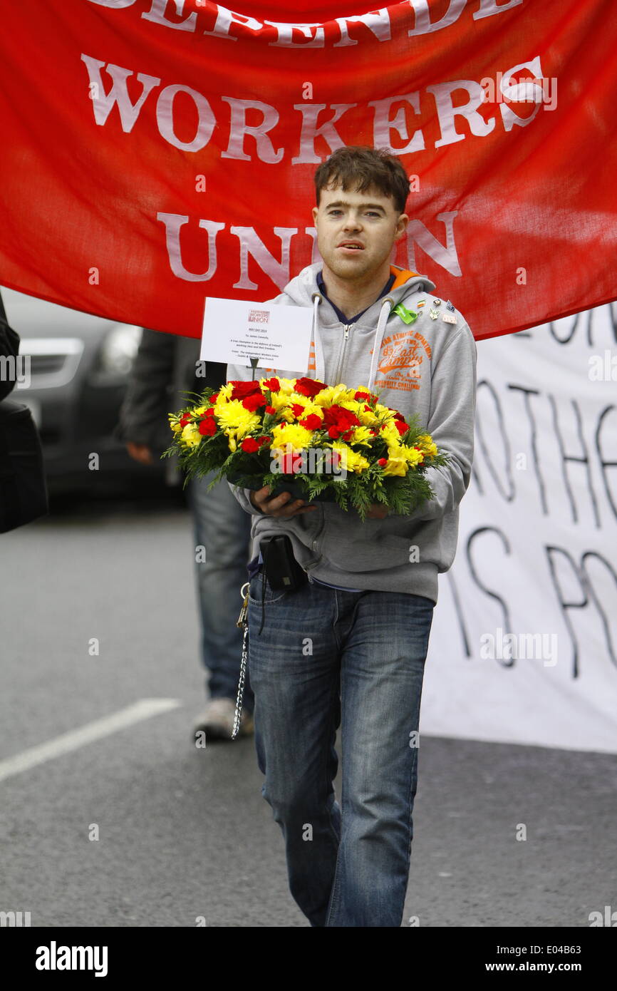 Dublin, Ireland. 1st May 2014. An activists carrying a wreath leads the ...