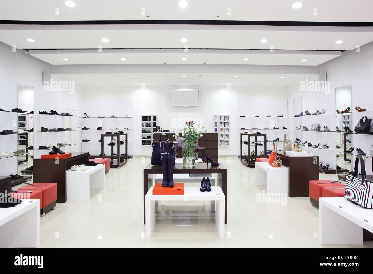 clean and bright luxury european shoes store Stock Photo - Alamy