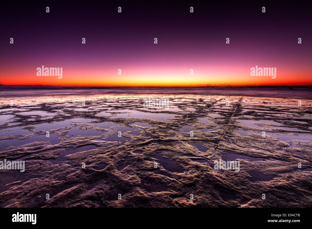 A sunrise at Long Reef rock platform in Sydney, Australia Stock Photo ...