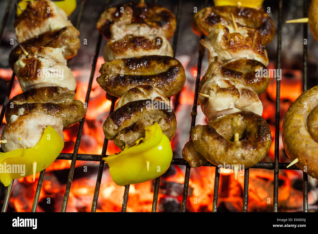 different types of meat cooking outside on a barbecue Stock Photo - Alamy