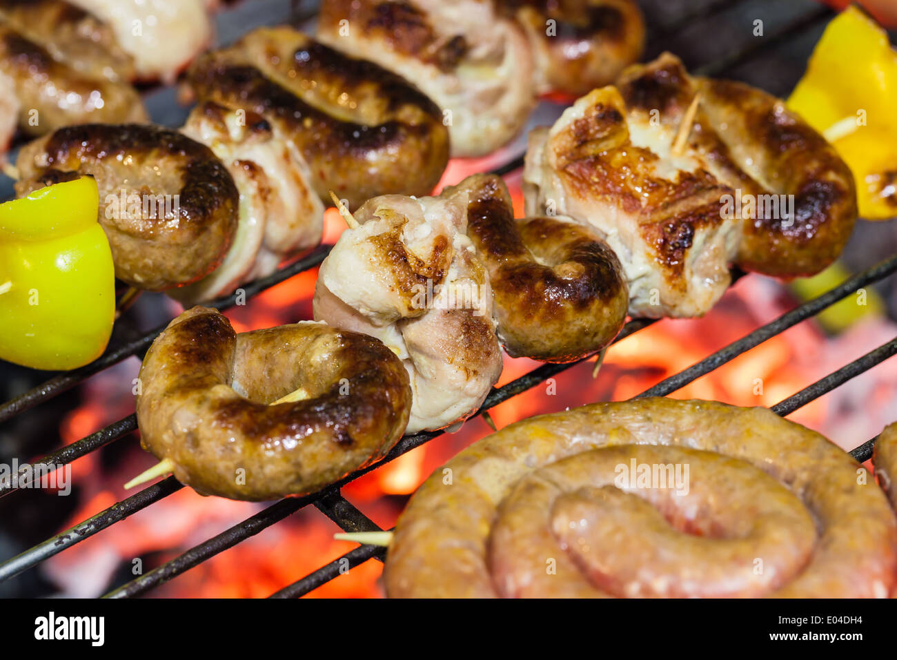different types of meat cooking outside on a barbecue Stock Photo - Alamy