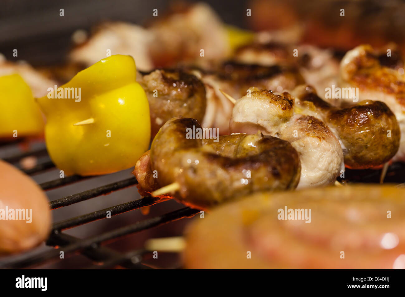 different types of meat cooking outside on a barbecue Stock Photo - Alamy
