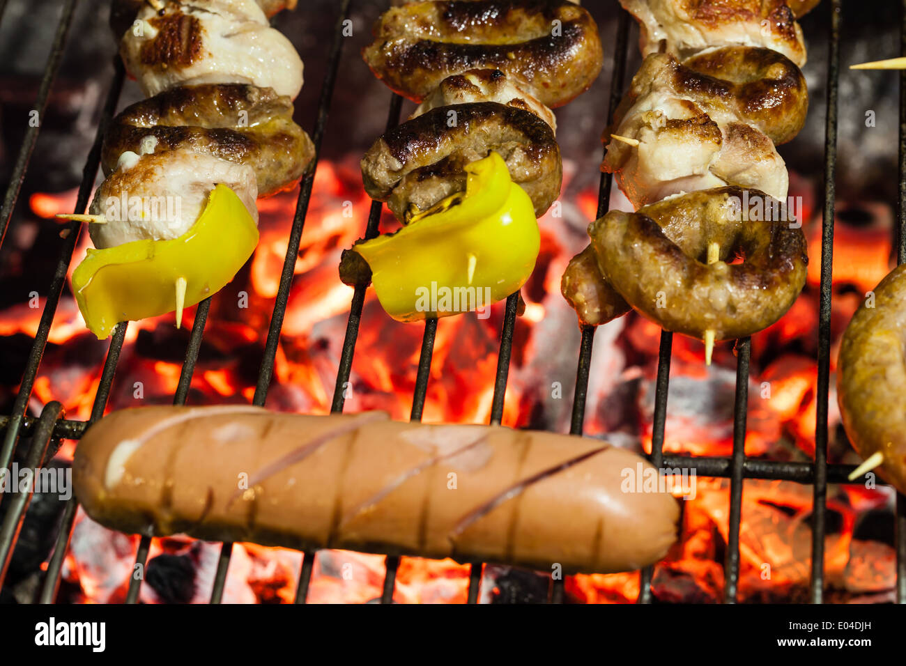 different types of meat cooking outside on a barbecue Stock Photo - Alamy