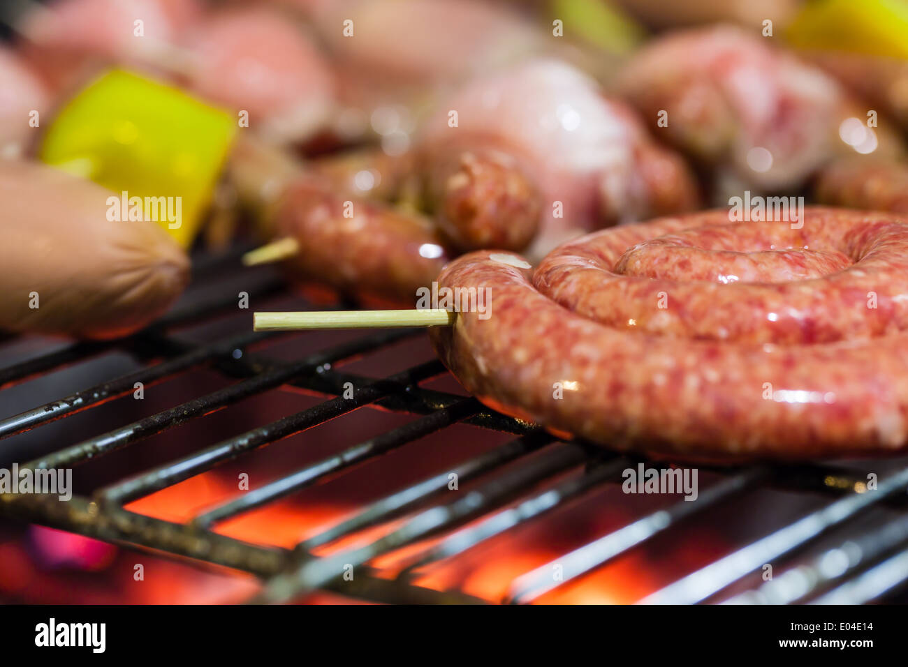 different types of meat cooking outside on a barbecue Stock Photo - Alamy