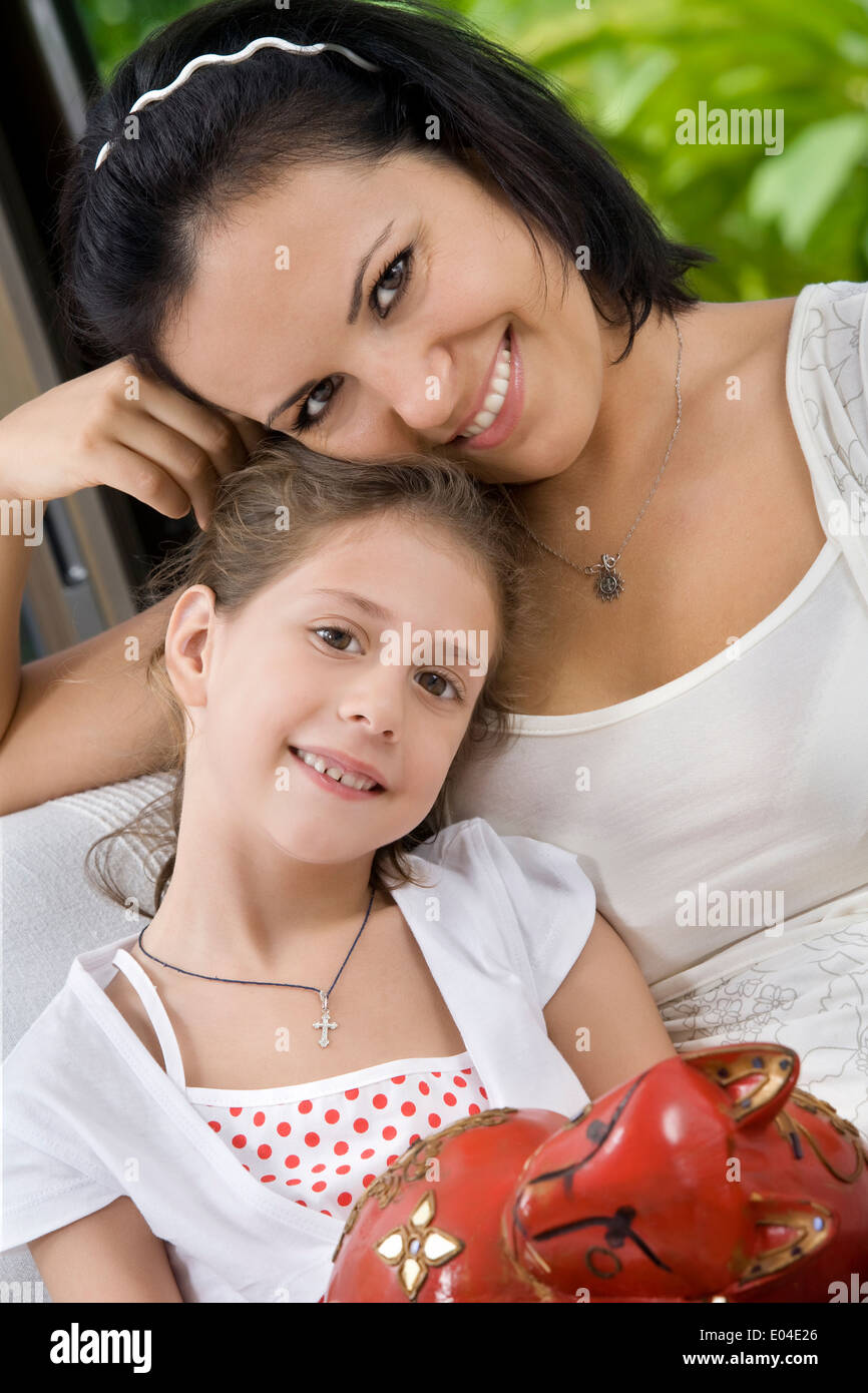 portrait of happy mother with daughter having good time in summer ...