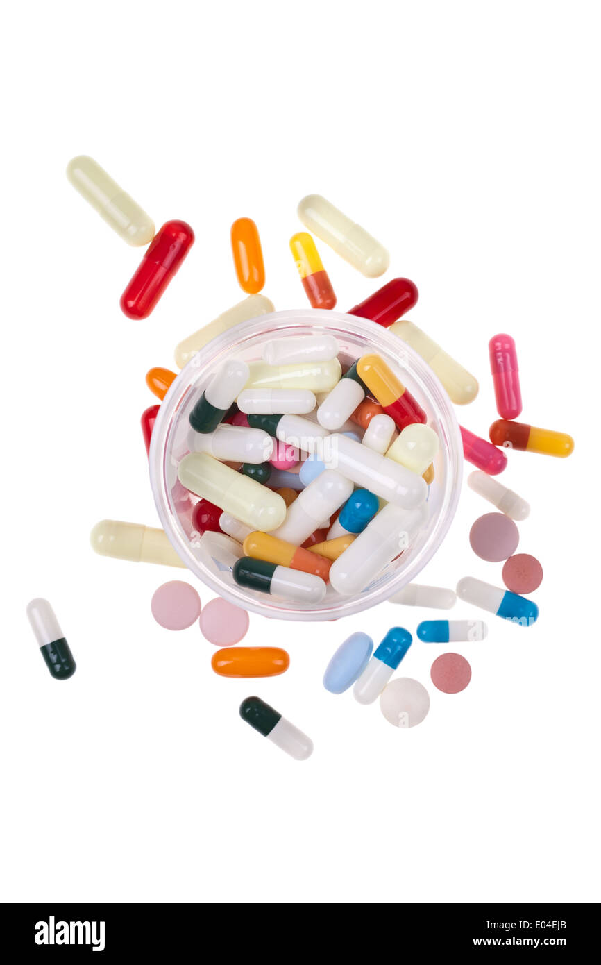 A lot of colored pills and tablets over a white background Stock Photo ...