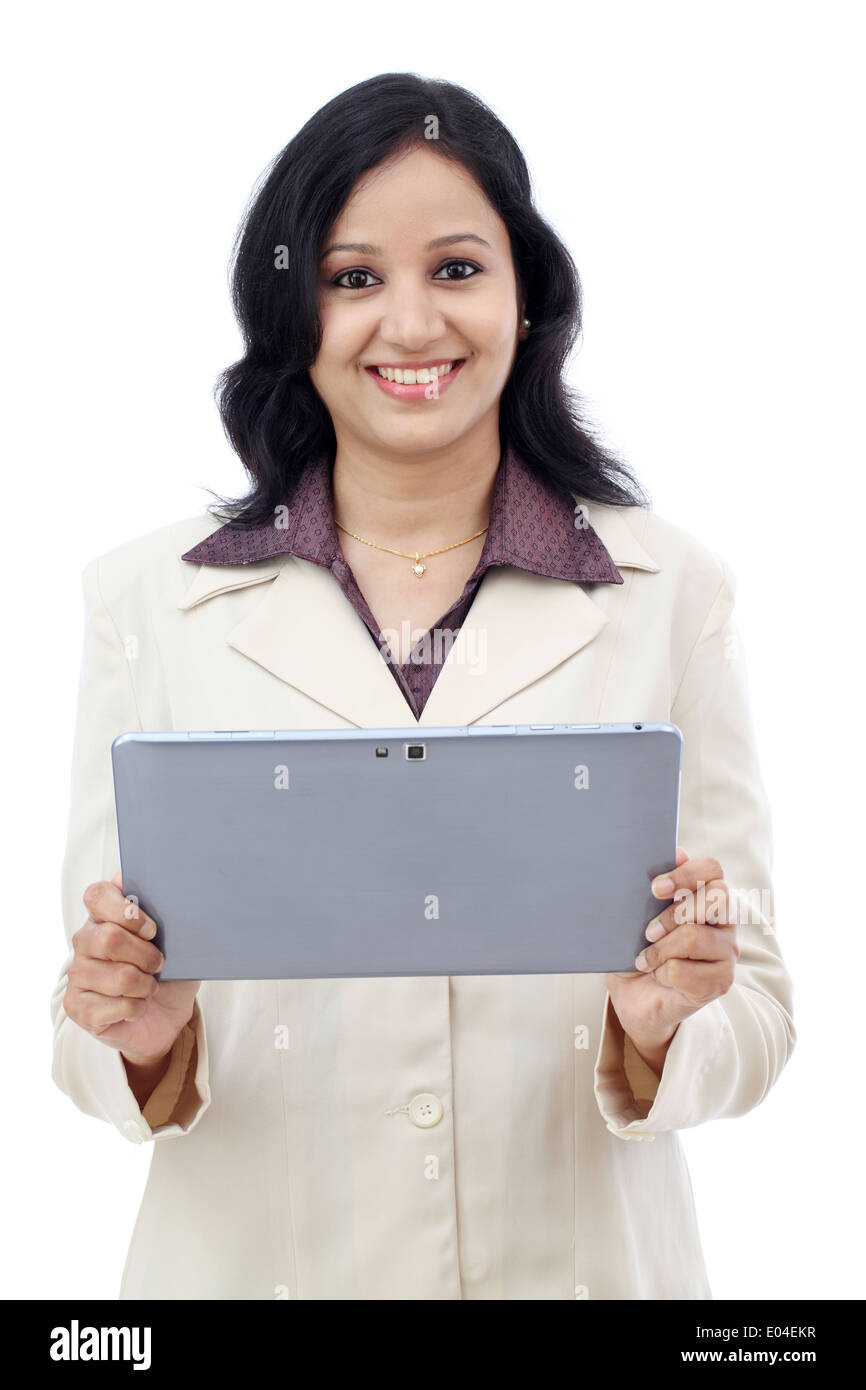 Happy young Indian business woman with tablet against white Stock Photo ...
