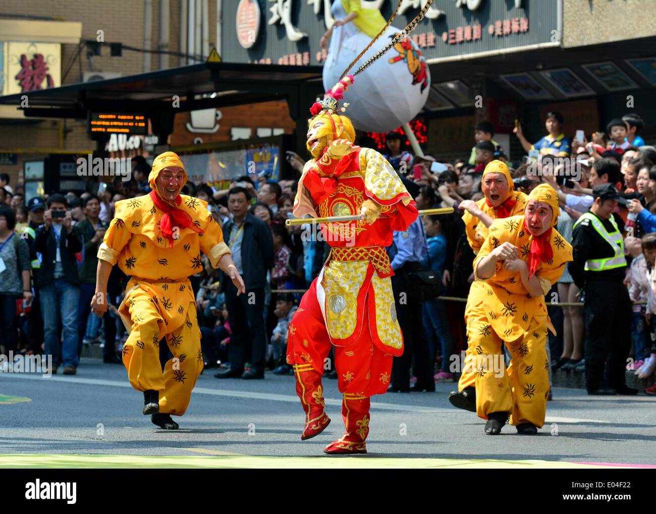 Hangzhou. 1st May, 2014. People take part in a parade during the 10th ...