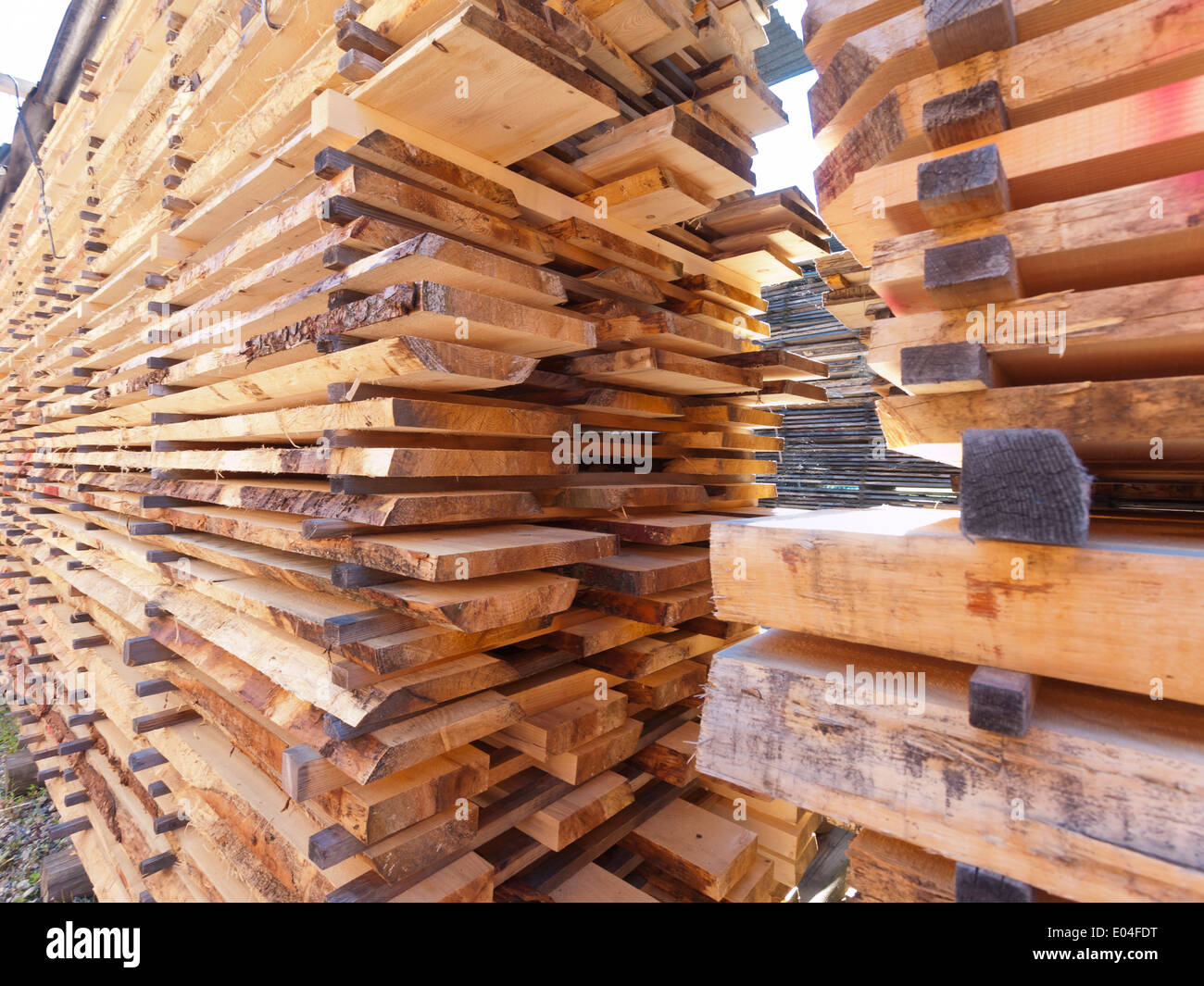 huge batches of lumber / wood stacked for further processing in a ...