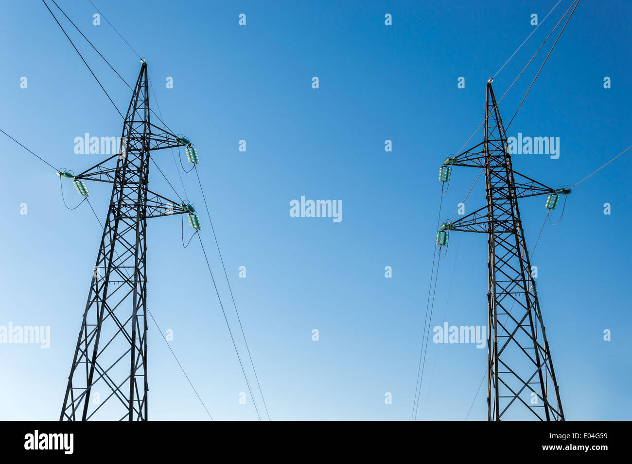 High-voltage electricity pylons, view from below Stock Photo - Alamy