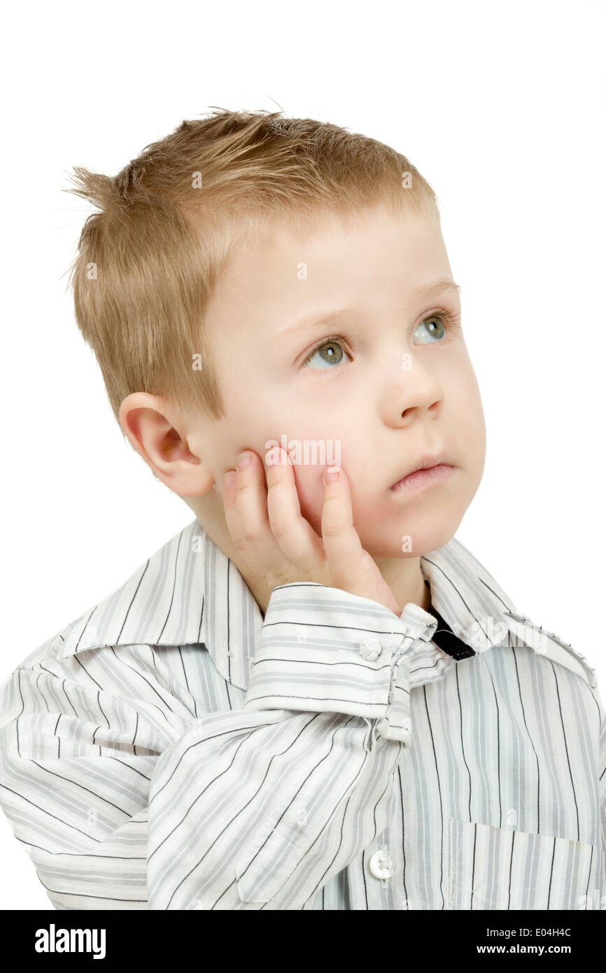 Studio portrait of young pensive beautiful boy on white background ...