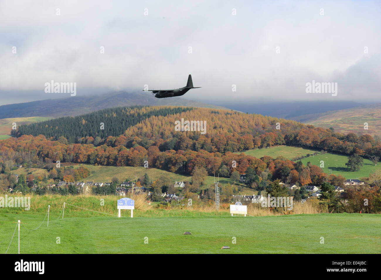 Plane flying over Moffat golf course Stock Photo - Alamy