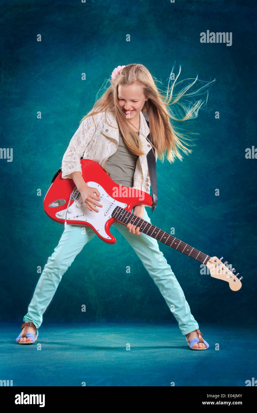 portrait of young girl with a guitar on the stage Stock Photo - Alamy