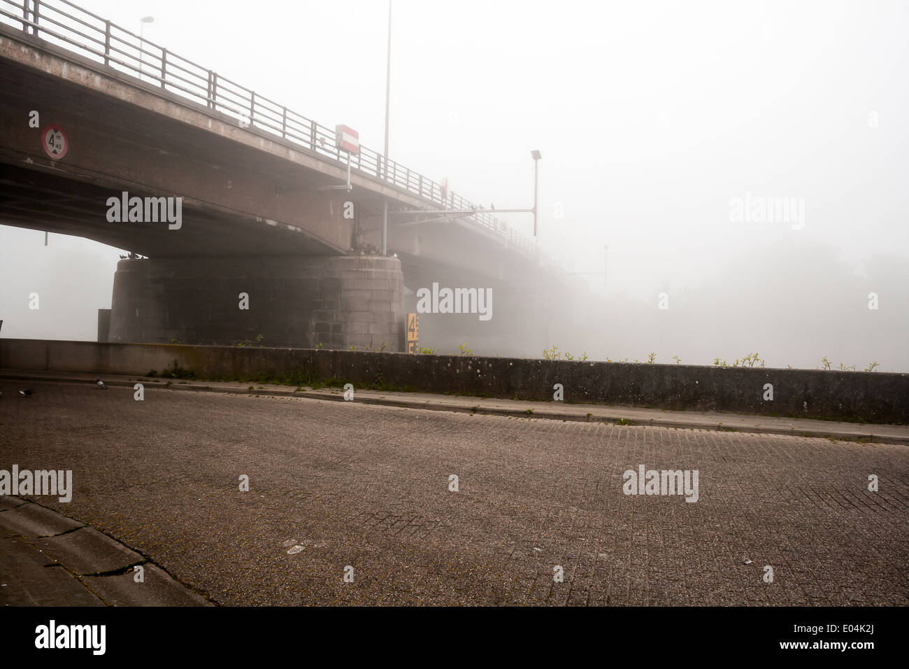 this bridge is under a thick fog the morning of the day Stock Photo - Alamy