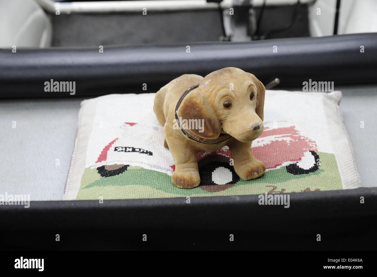 Cologne, Germany. 27th Apr, 2014. A dashboard dog on a cushion in an ...