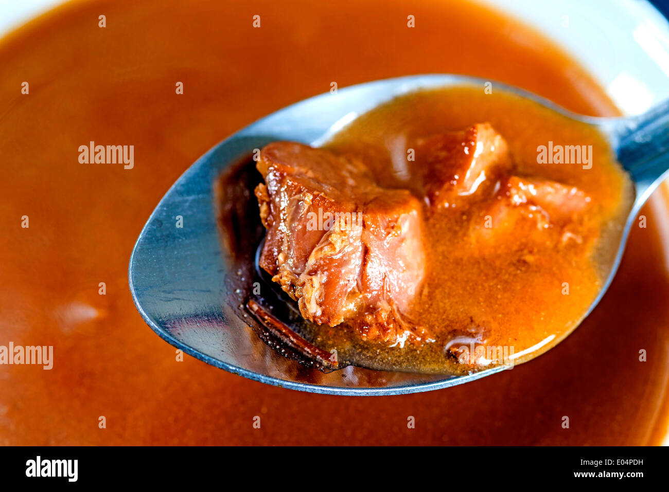 duck soup with meat on a spoon Stock Photo - Alamy