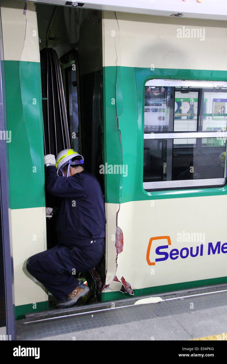 Seoul, South Korea. 2nd May, 2014. A mechanic checks the damage to ...