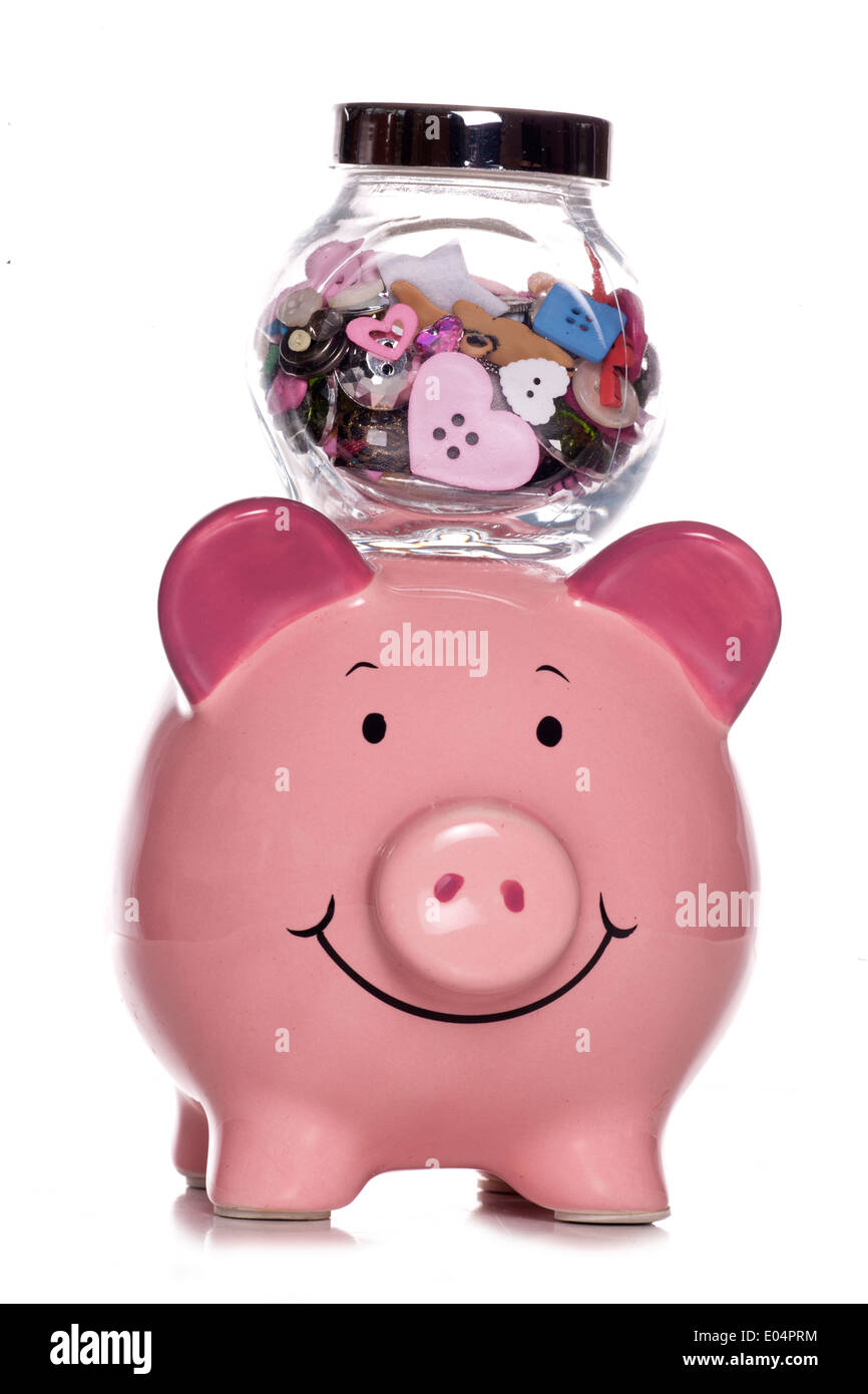 piggy bank and jar of buttons studio cutout Stock Photo - Alamy