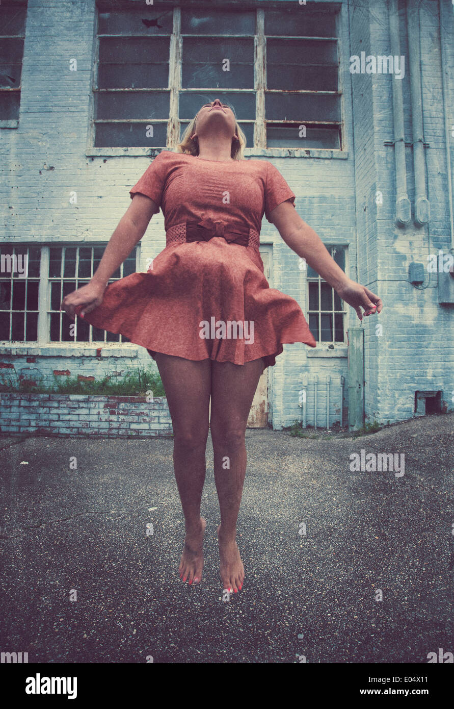 Girl leaping or flying in air Stock Photo - Alamy