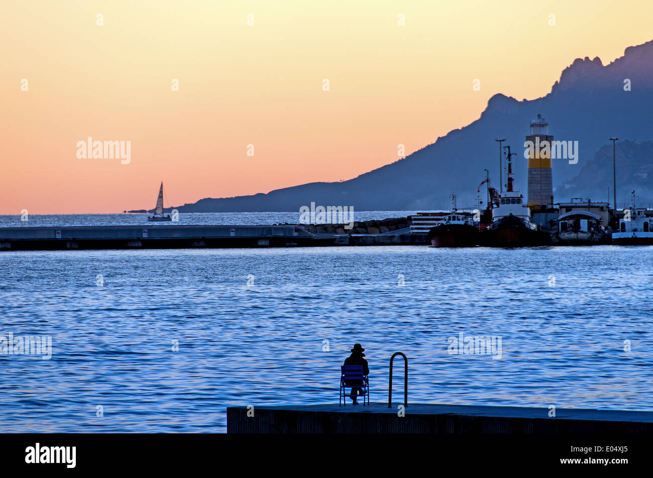 Europe, France, Alpes-Maritimes, Cannes. Sunset at the port of Cannes ...