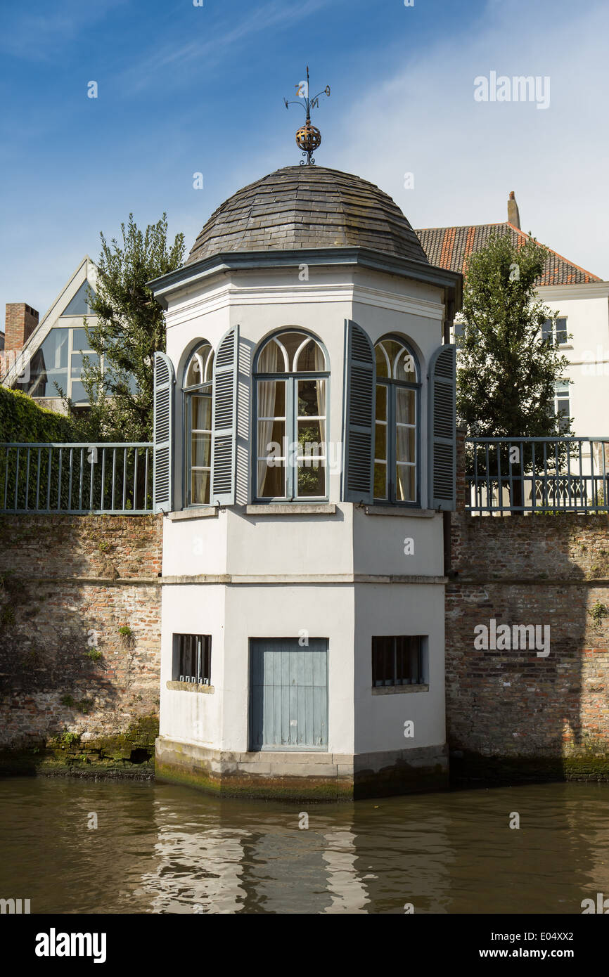 White octagonal summer house by the Groenerei canal, Bruges, Belgium ...