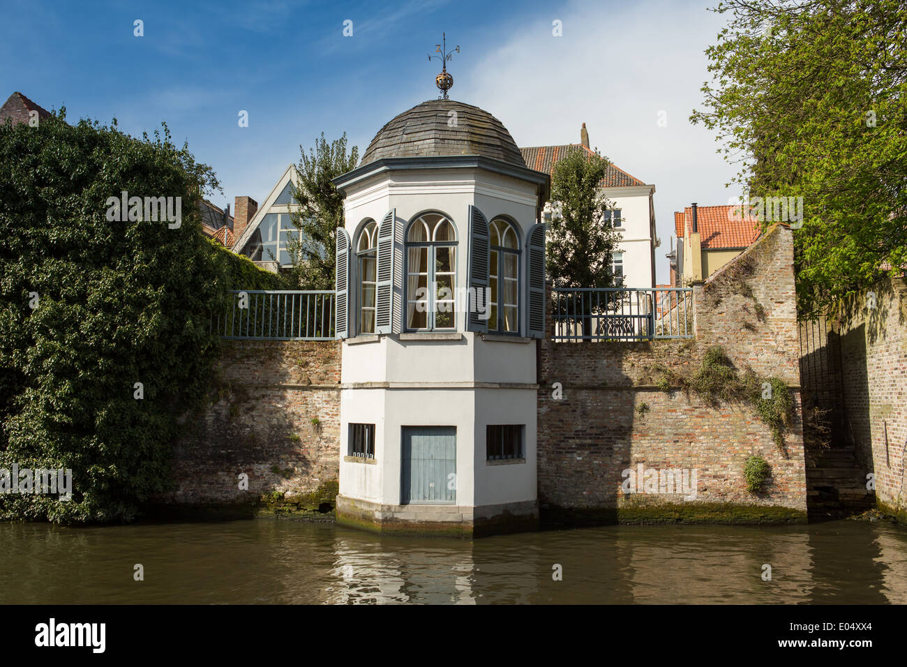 White octagonal summer house by the Groenerei canal, Bruges, Belgium ...