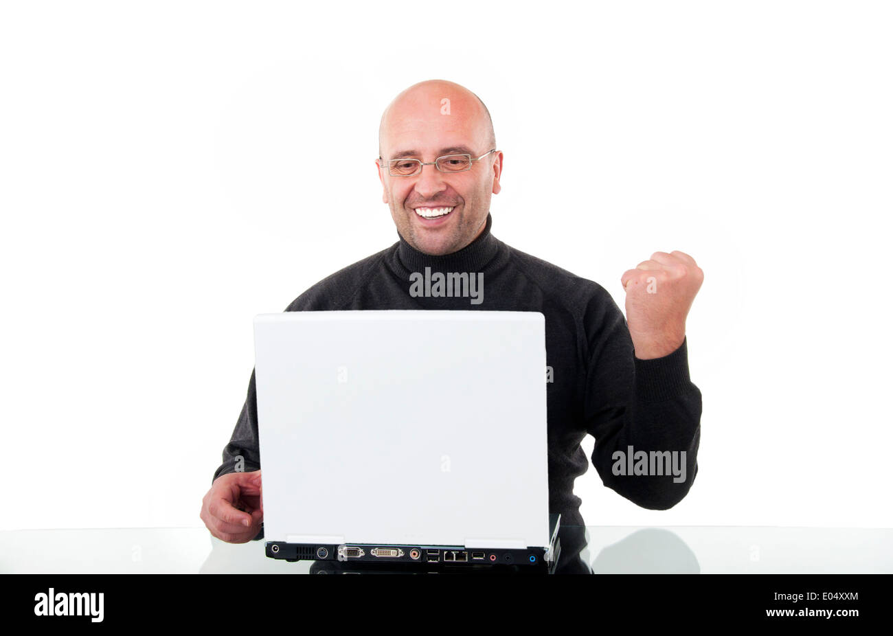 Businessman celebrating his success with a computer isolated on white ...