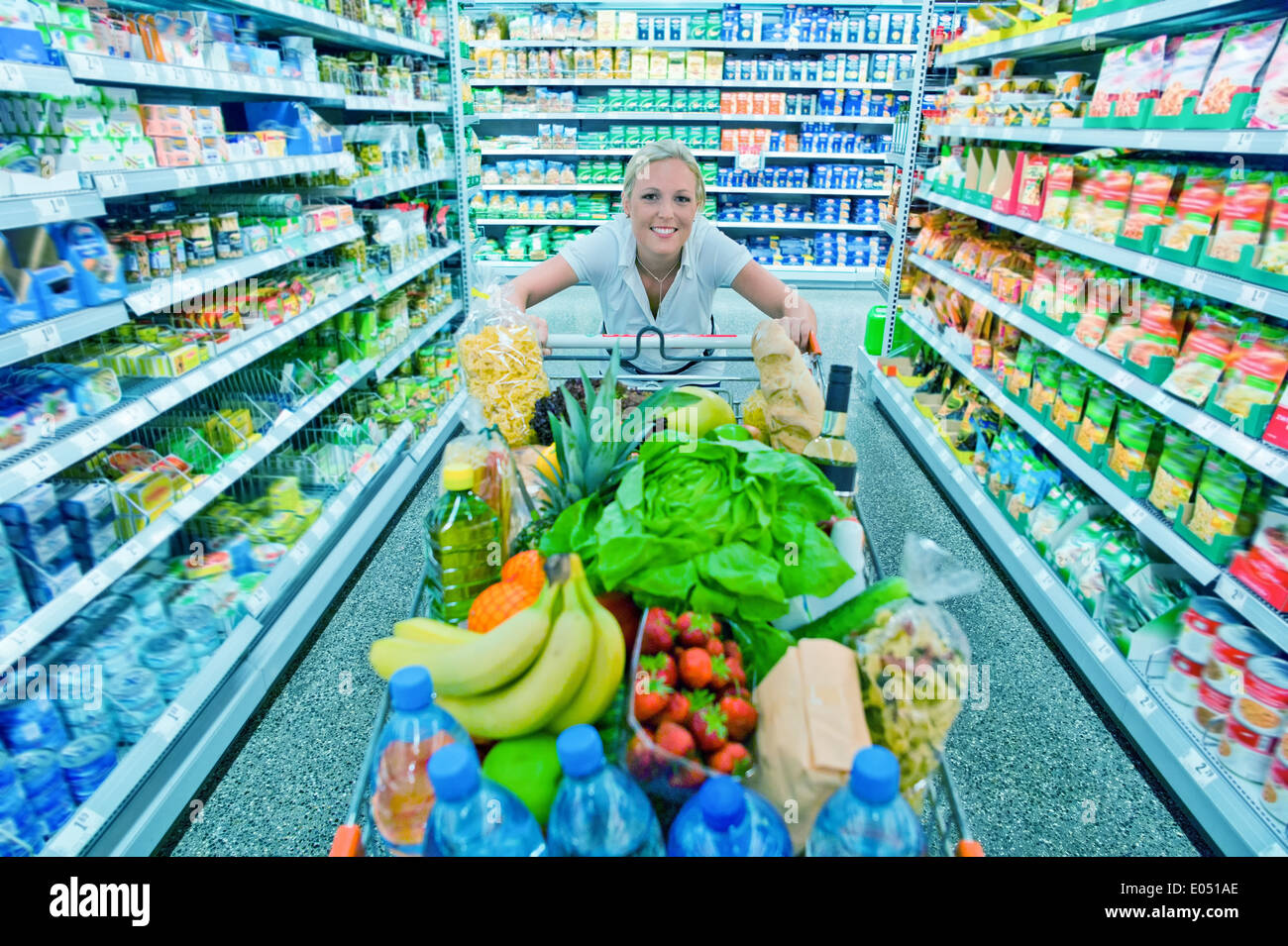 A woman with the purchase of food in a supermarket. Everyday life of a ...