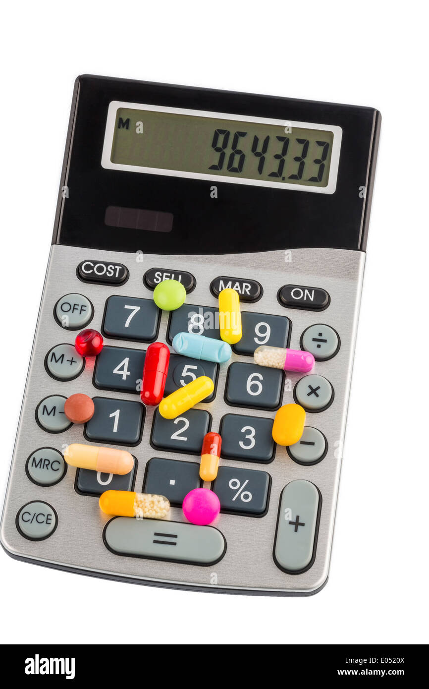 Tablets lie on a pocket calculator. Symbolic photo for costs in the ...
