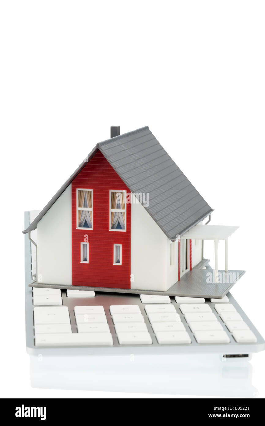 Dwelling house on keyboard, symbolic photo for house purchase and ...