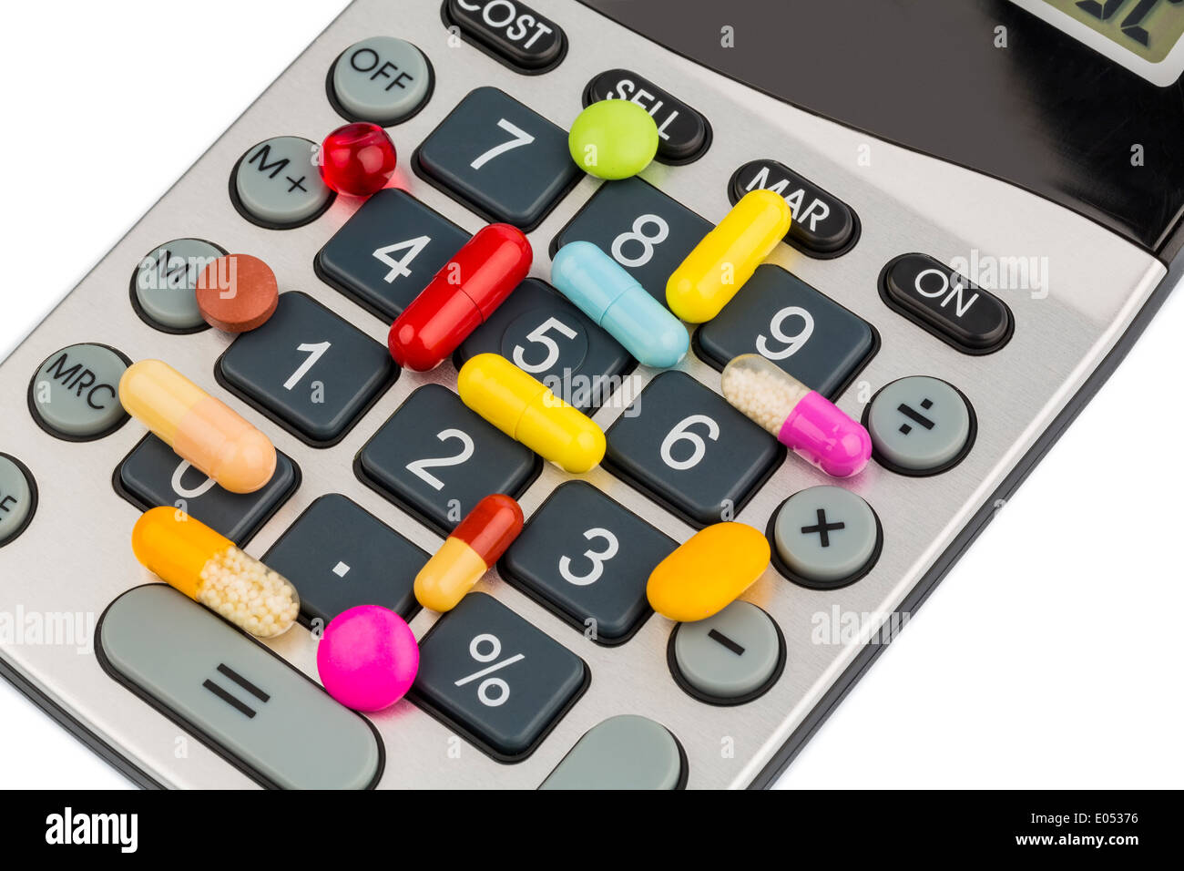 Tablets lie on a pocket calculator. Symbolic photo for costs in the ...