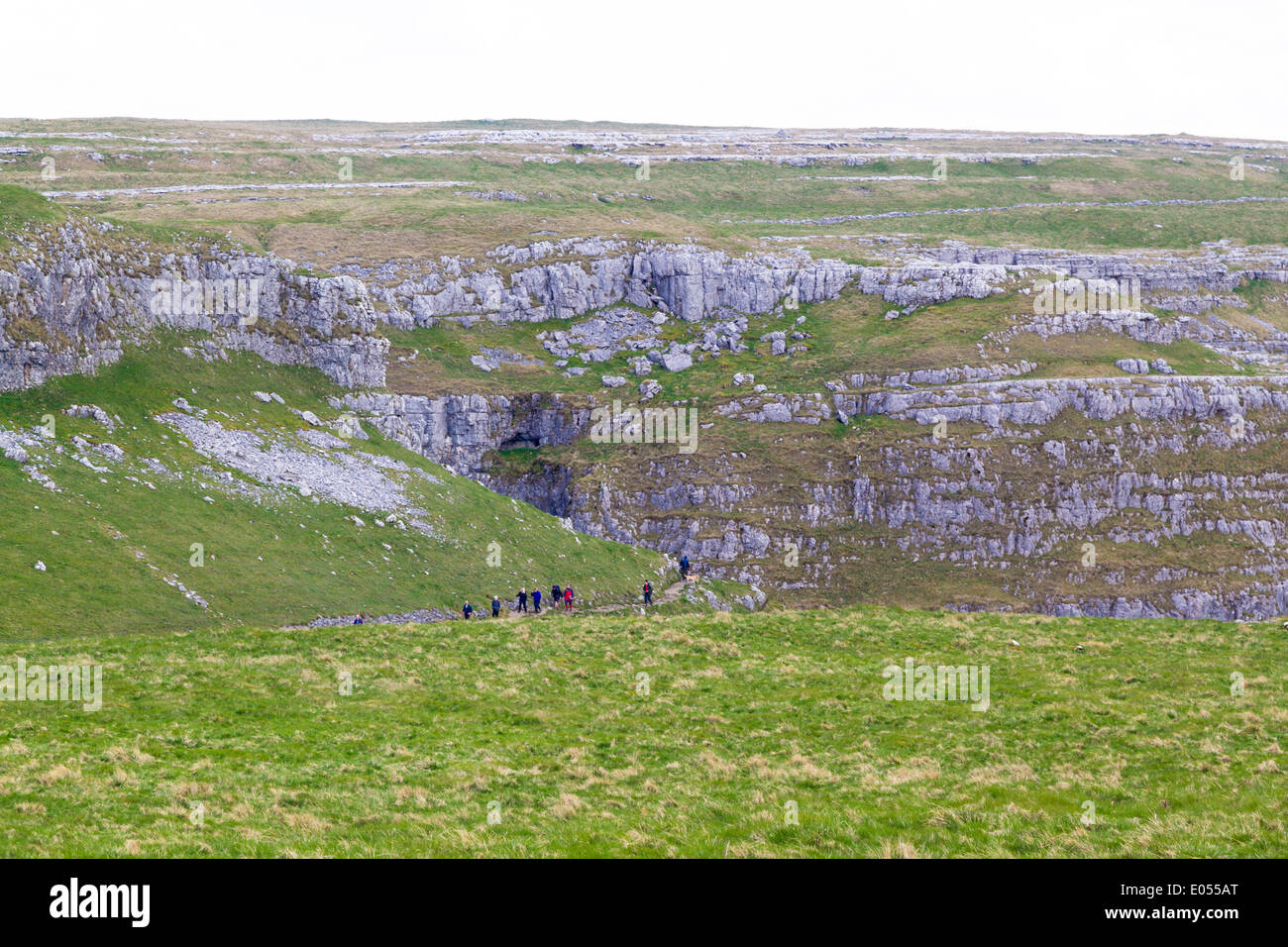 Walkers make their way out of the Malham Cove complex, on the Pennine ...