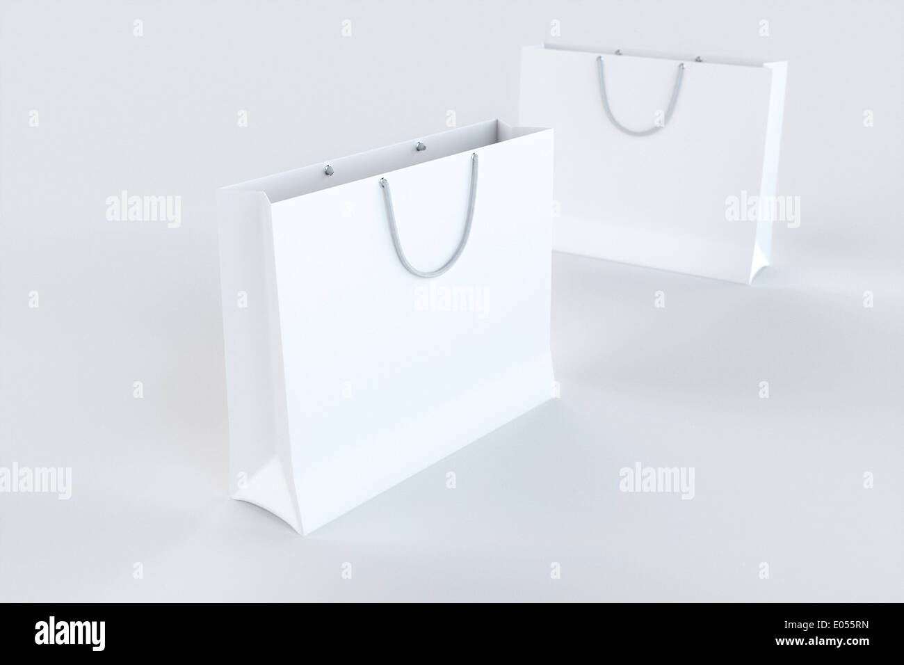 Empty Paper Shopping Bags on white surface Stock Photo - Alamy