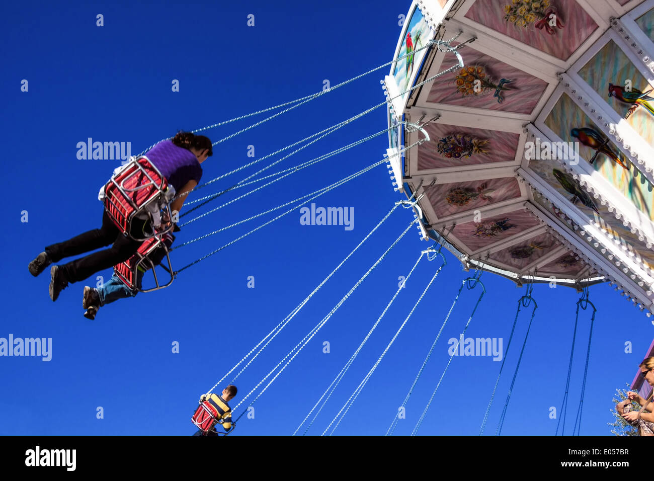 Children on a roundabout at a fun fair hi-res stock photography and ...