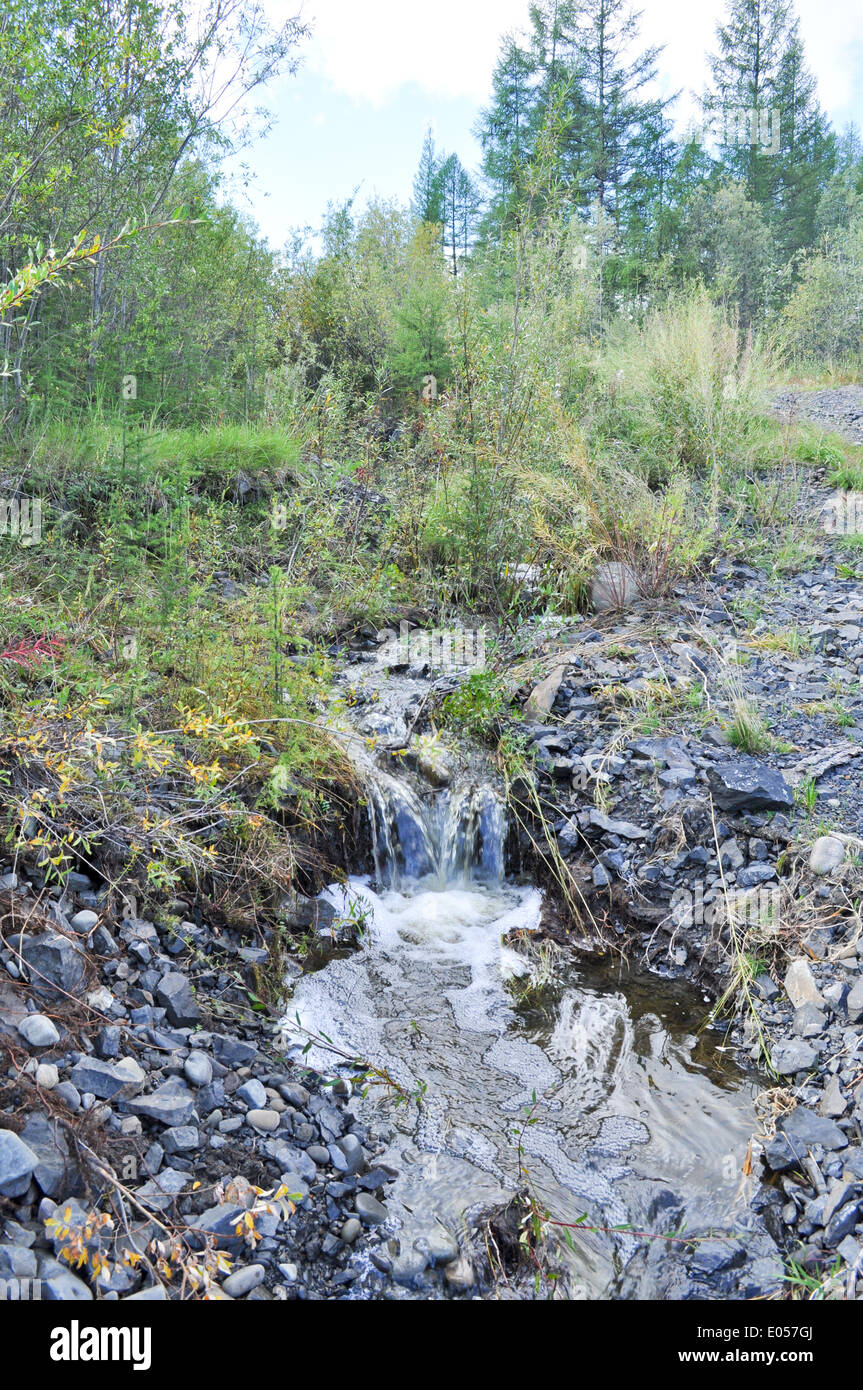 Stream, babbling over the rocks in Yakutia. Ridge Suntar-khayata, river ...