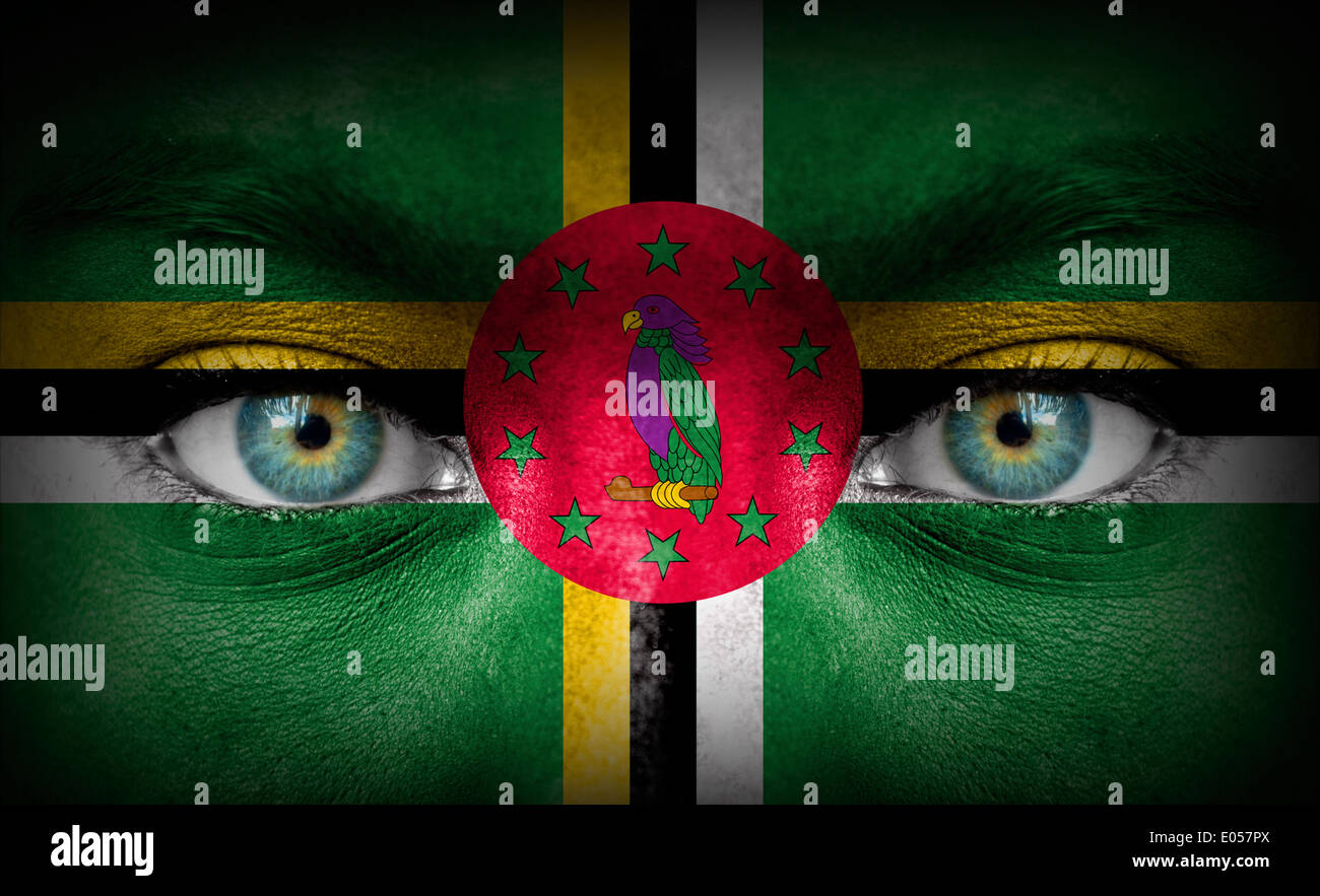 Human face painted with flag of Dominica Stock Photo - Alamy