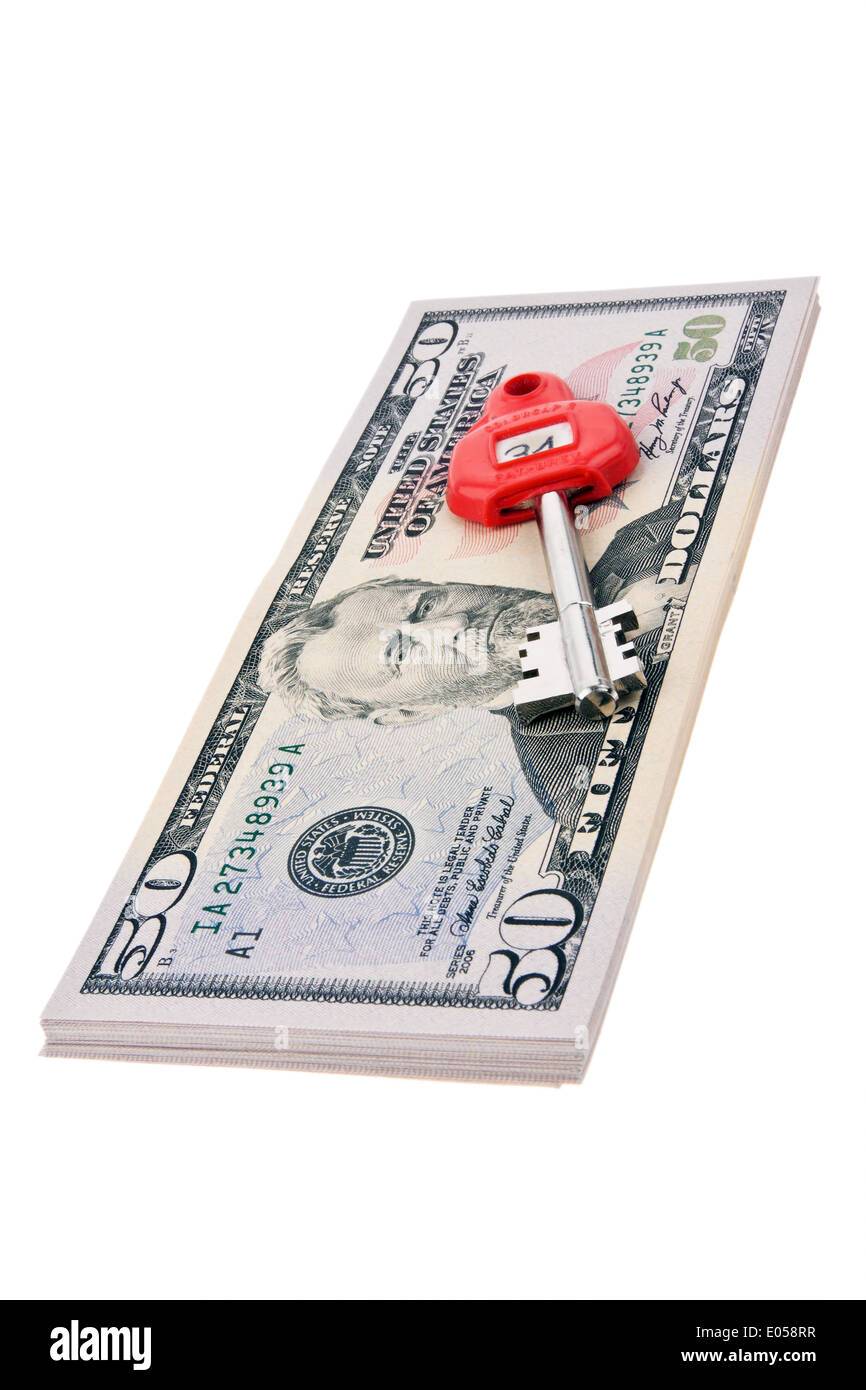 Dollar of bank notes and safe deposit key. Isolated on white background ...