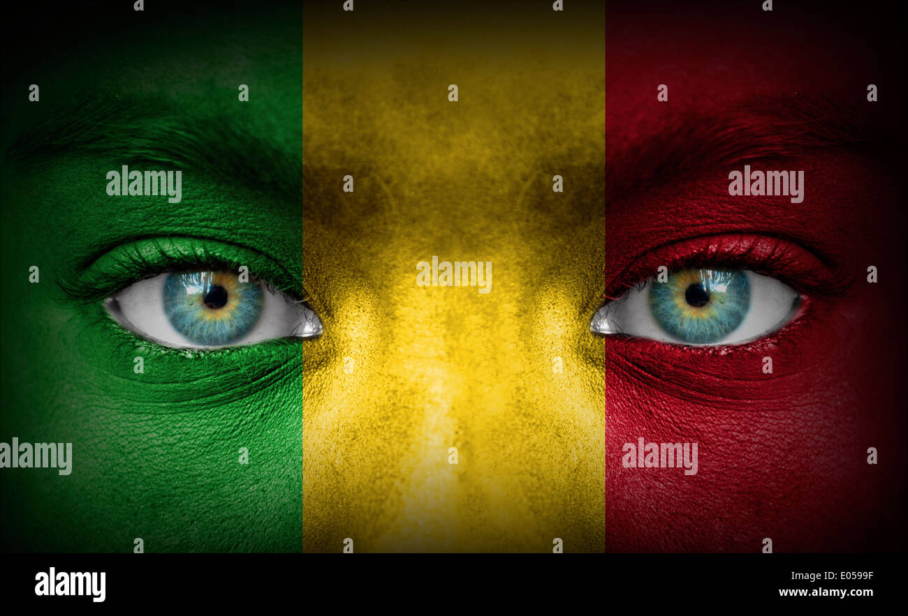 Human face painted with flag of Mali Stock Photo - Alamy