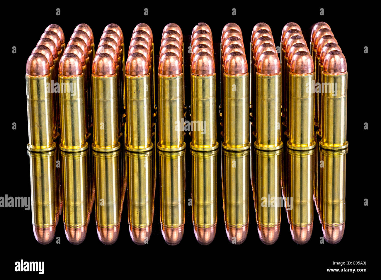 Box of brass bullets standing in a row Stock Photo - Alamy