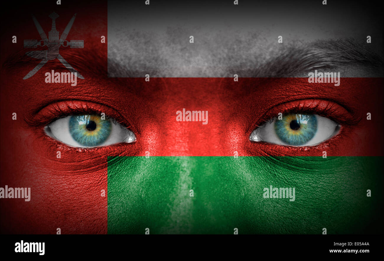 Human face painted with flag of Oman Stock Photo - Alamy