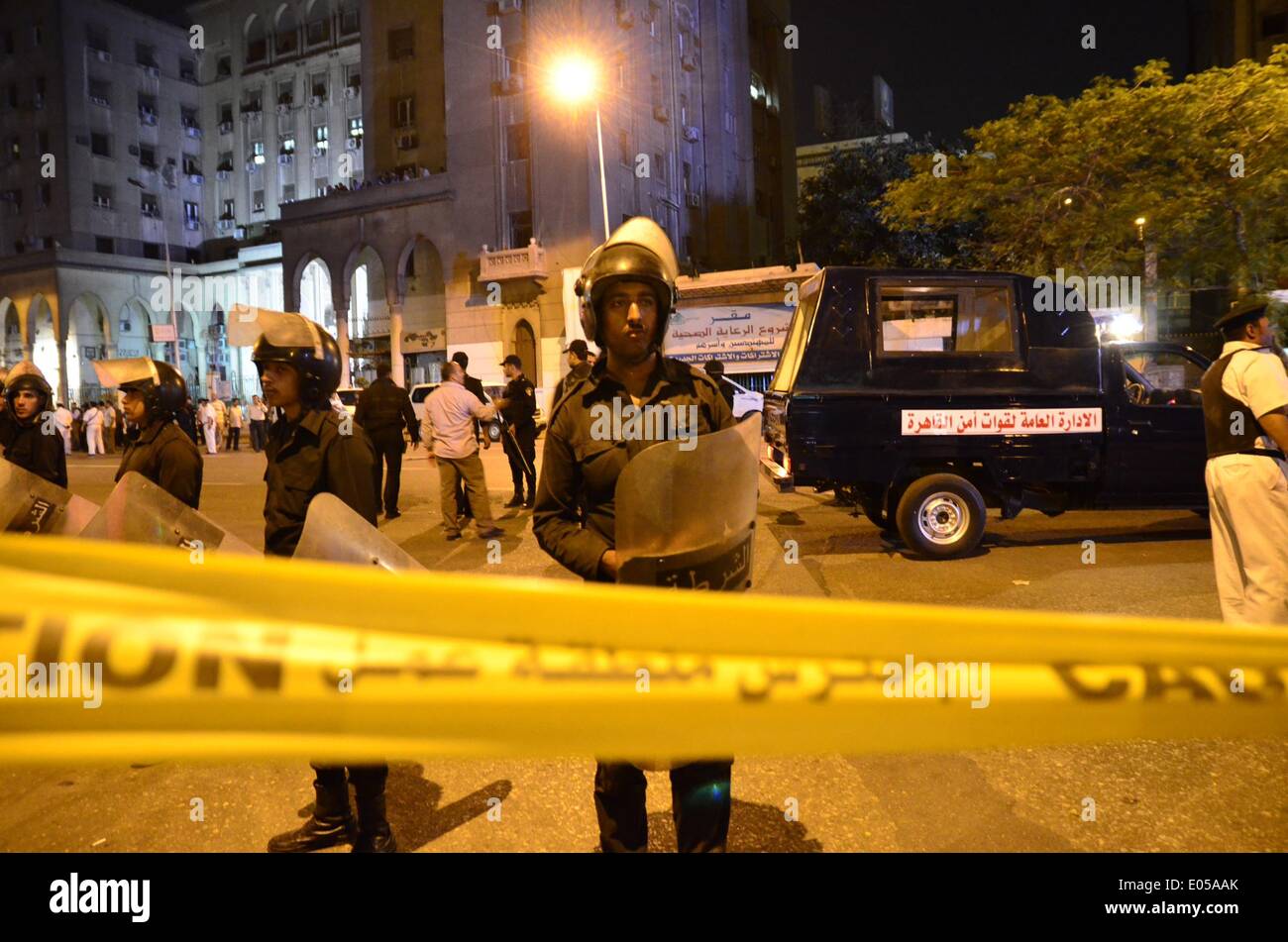 Cairo, Egypt. 2nd May, 2014. Policemen stand guard at an explosion site ...