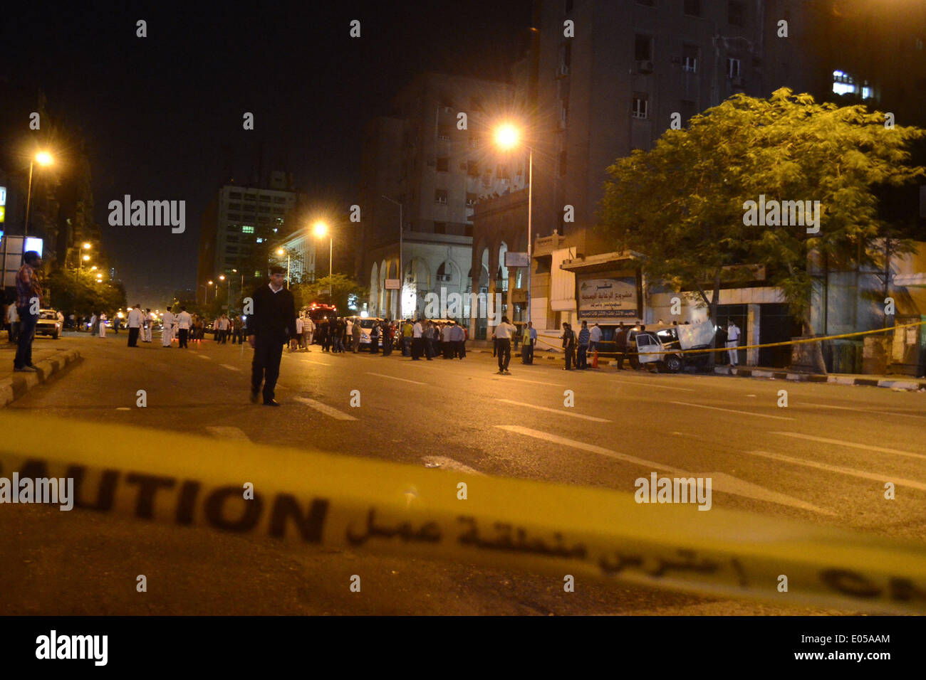 Cairo, Egypt. 2nd May, 2014. Policemen stand guard at an explosion site ...