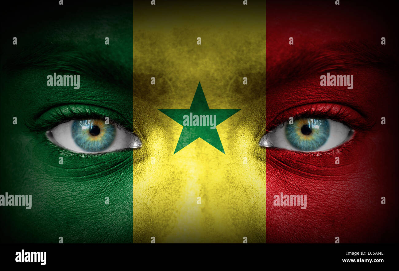 Human face painted with flag of Senegal Stock Photo - Alamy