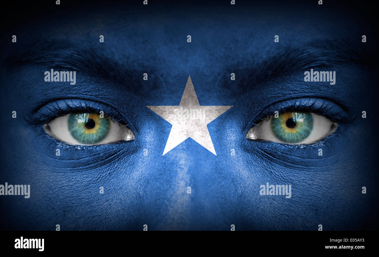 Human face painted with flag of Somalia Stock Photo - Alamy