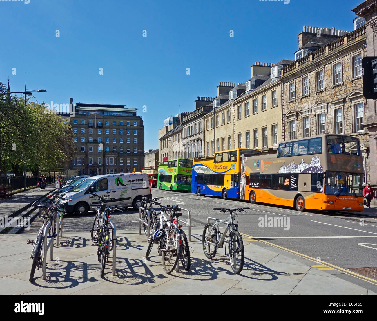 Cycle racks and city tour buses in St. Andrew Square Edinburgh Scotland ...