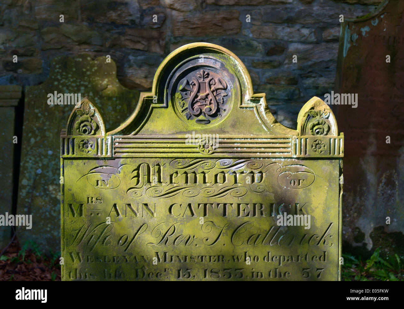 Gravestone with musical instruments design. Church of Saint Augustine ...