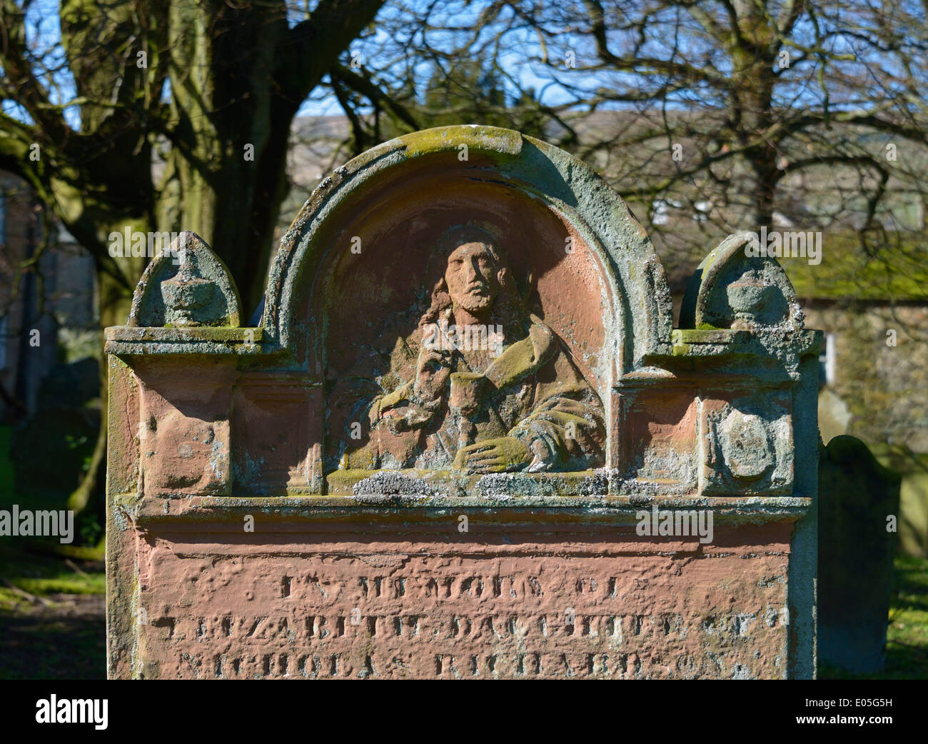 Badly eroded gravestone with figure of Christ. Church of Saint ...