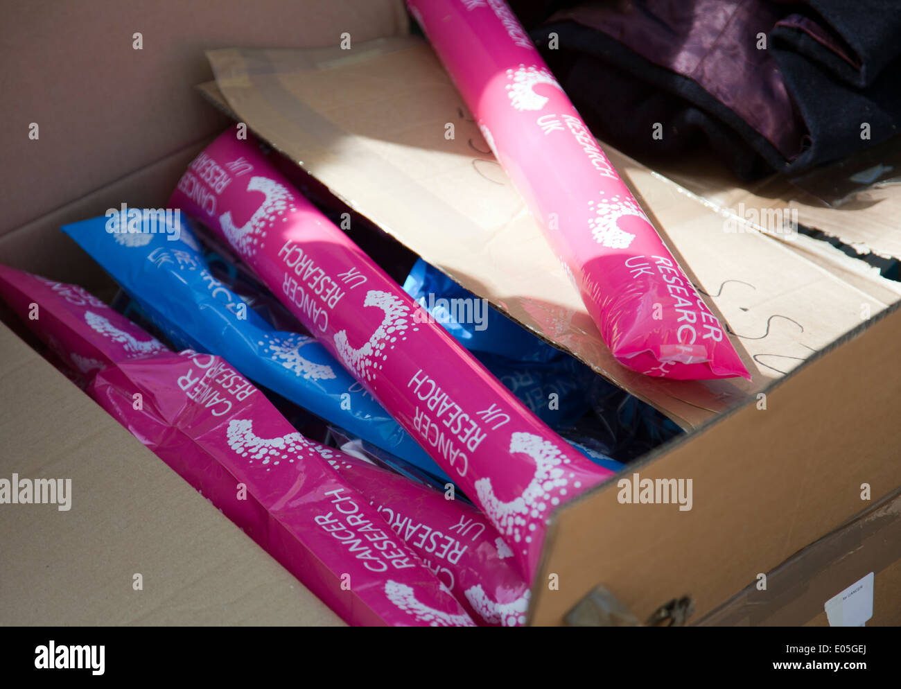 Box of Cancer Research Plastic Inflatable Batons - UK Stock Photo - Alamy